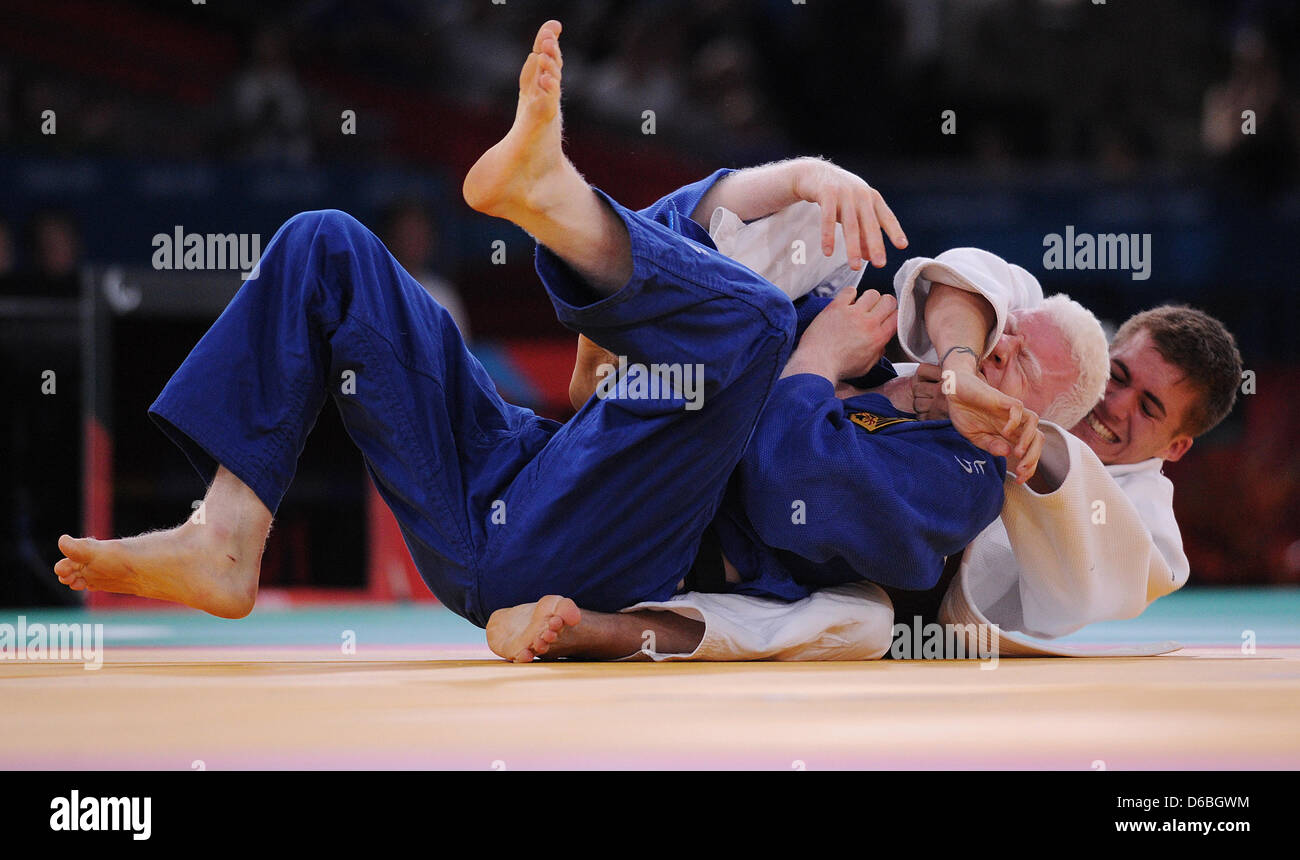 Matthias Krieger (blue) of Germany and Dan Powell of Great Britian ...