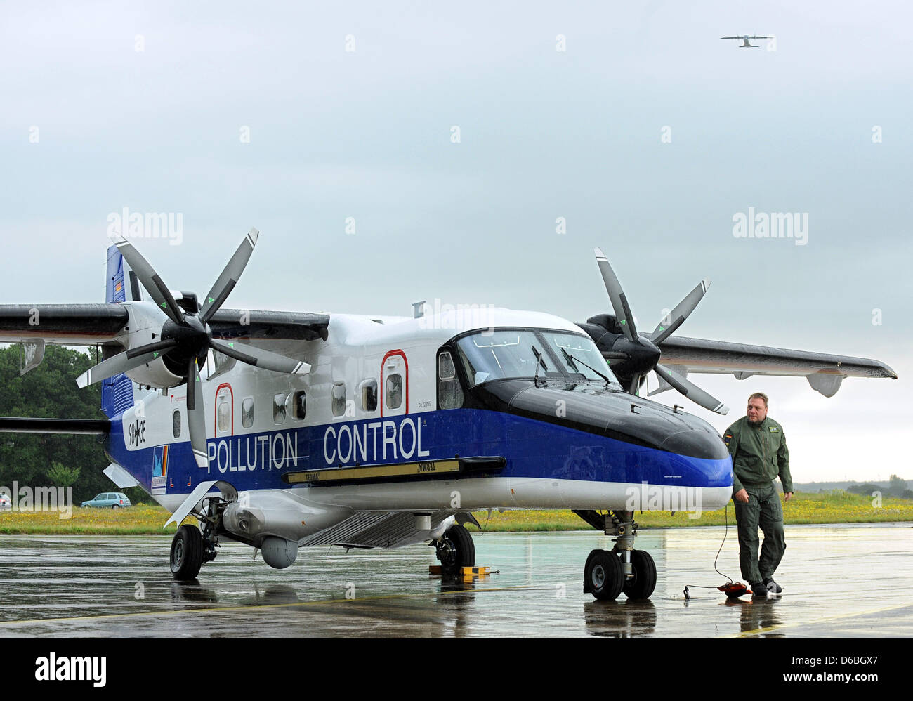Naval pilots prepare the new airplane of the model Dornier DO 228 of ...