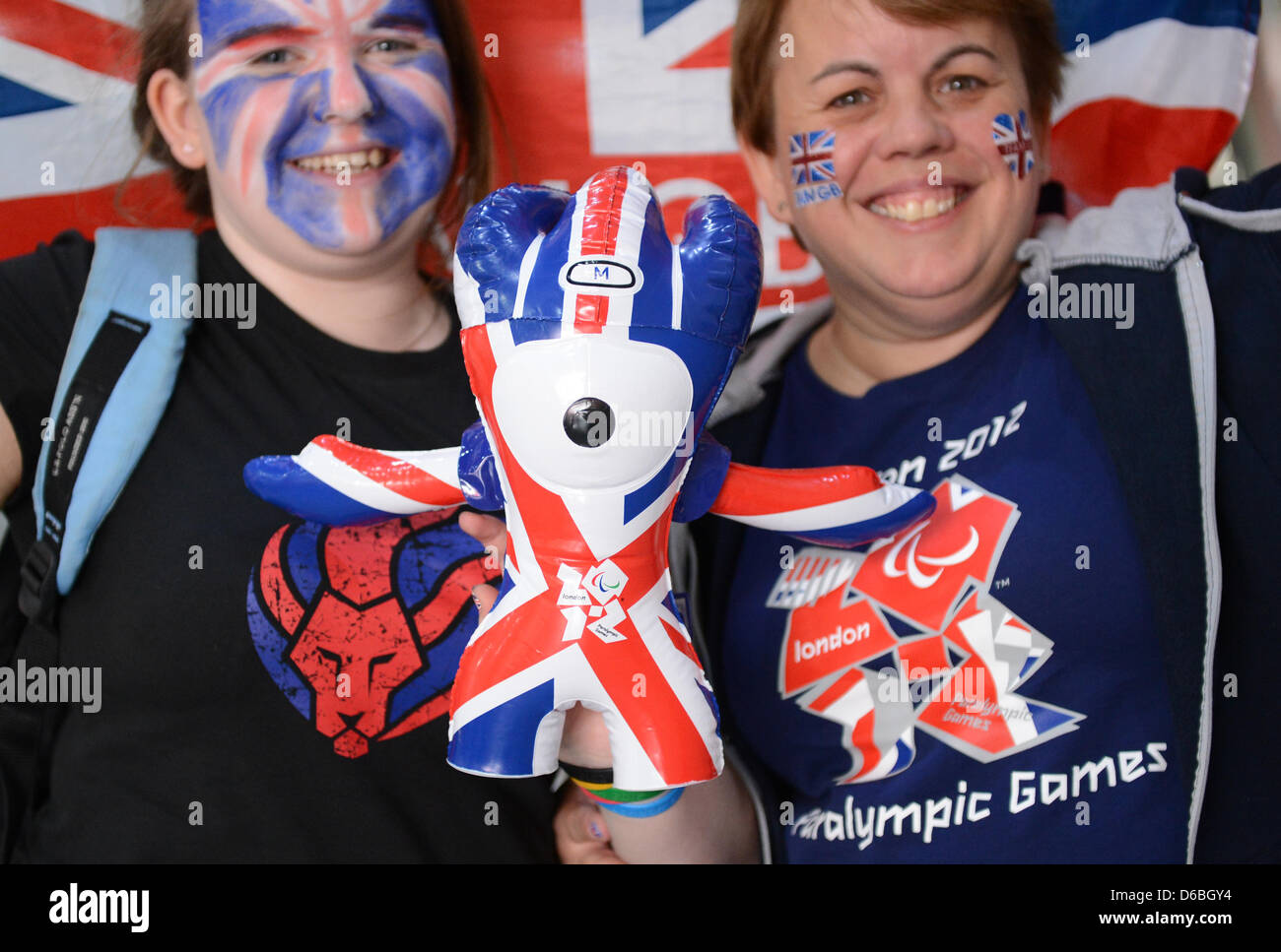 Spectators pose with mascot Mandeville in ExCel Centre during the ...