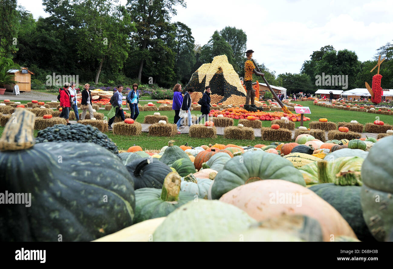 Visitors walk past pumpkins in the pumpkin exhibition in the "Flowering ...
