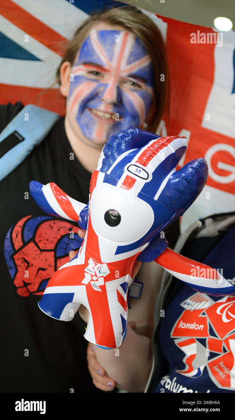 Spectators pose with mascot Mandeville in ExCel Centre during the ...