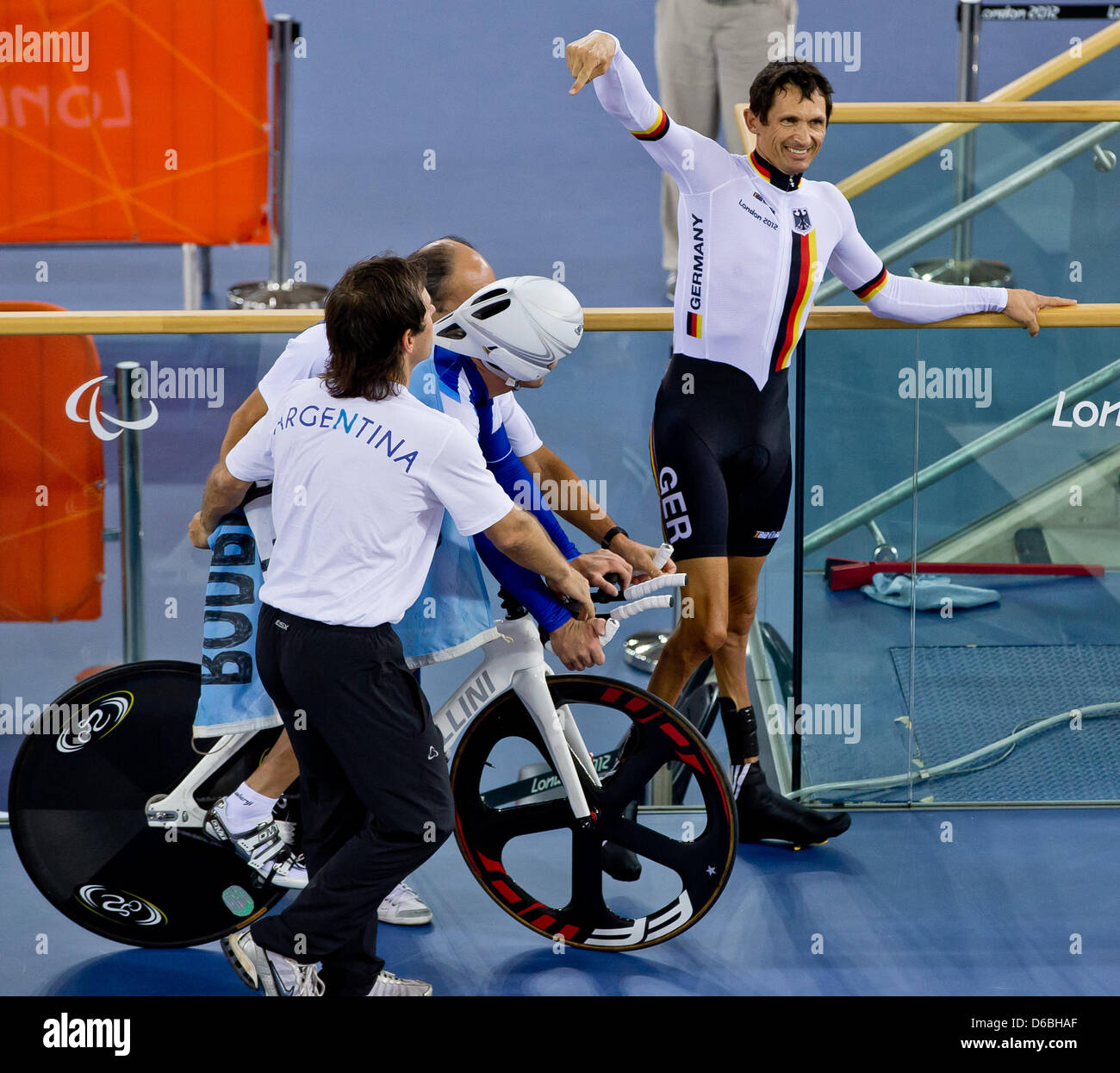 Michael Teuber of Germany (R) points to Rodrigo Fernando Lopez of ...