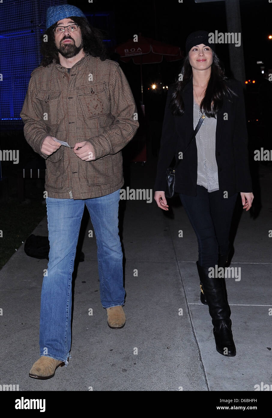 Adam Duritz from the band Counting Crows and a female companion are ...