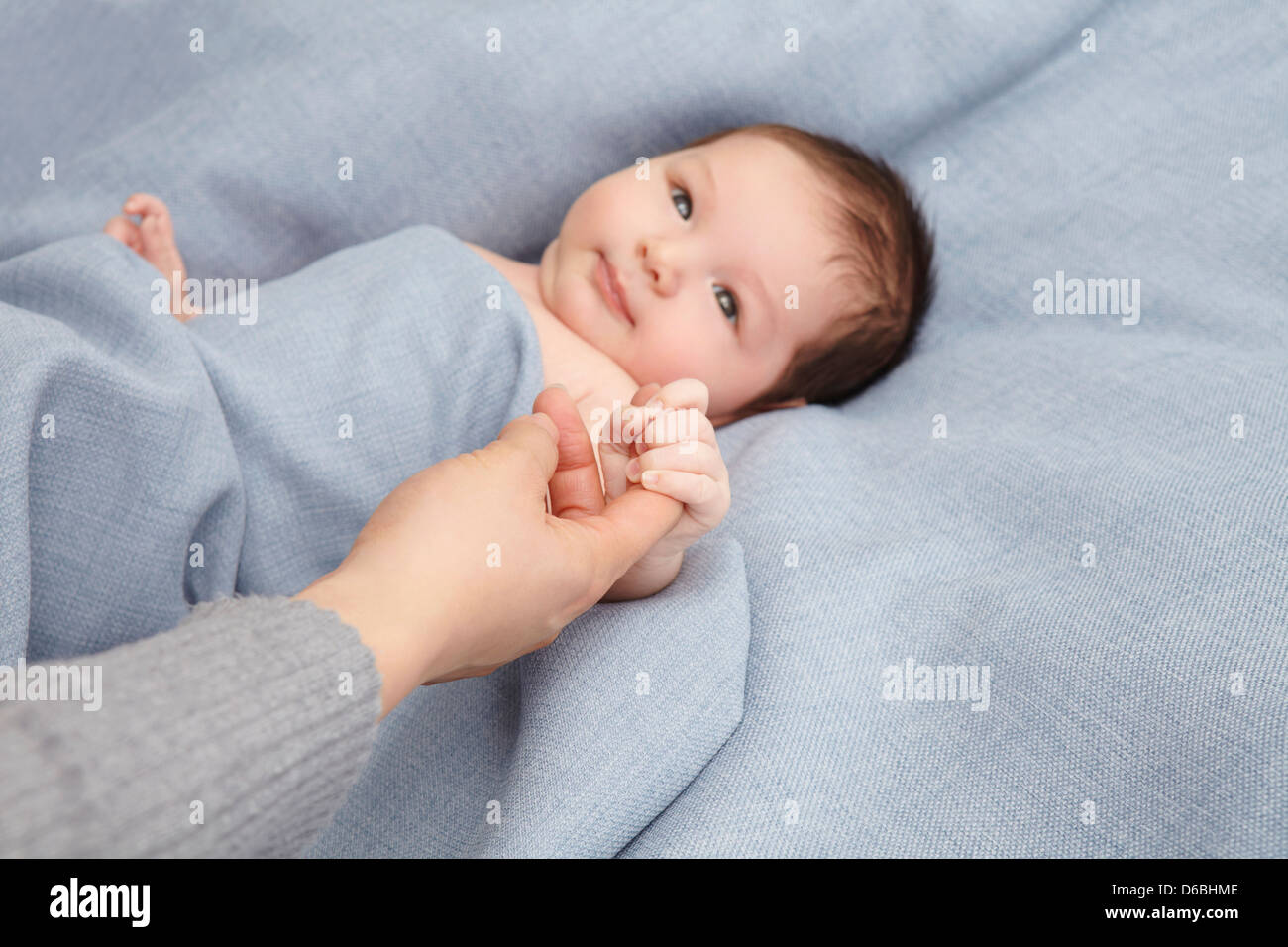 Baby hand holding mothers finger hi-res stock photography and images ...