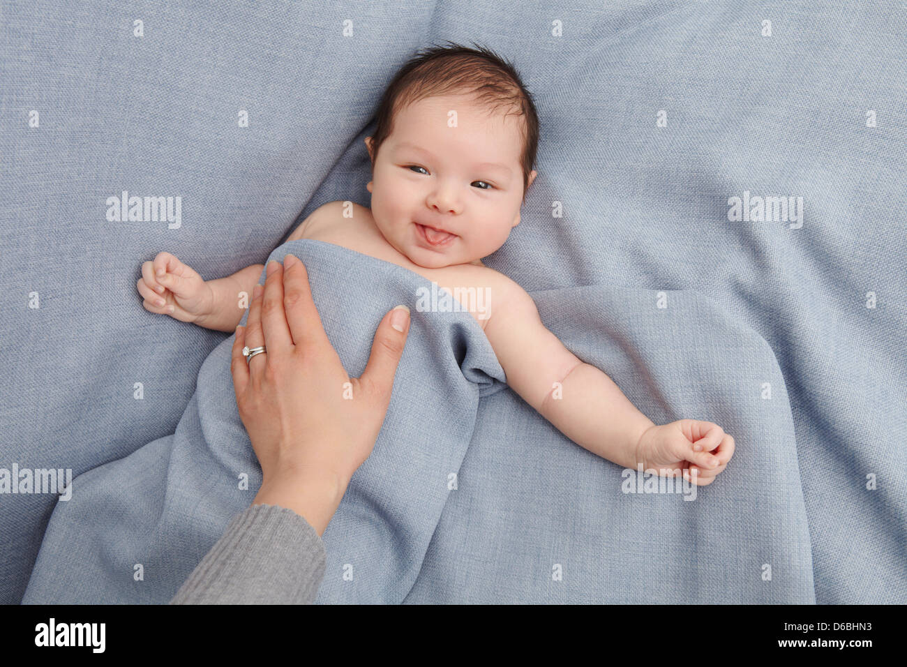 Mother patting baby hi-res stock photography and images - Alamy
