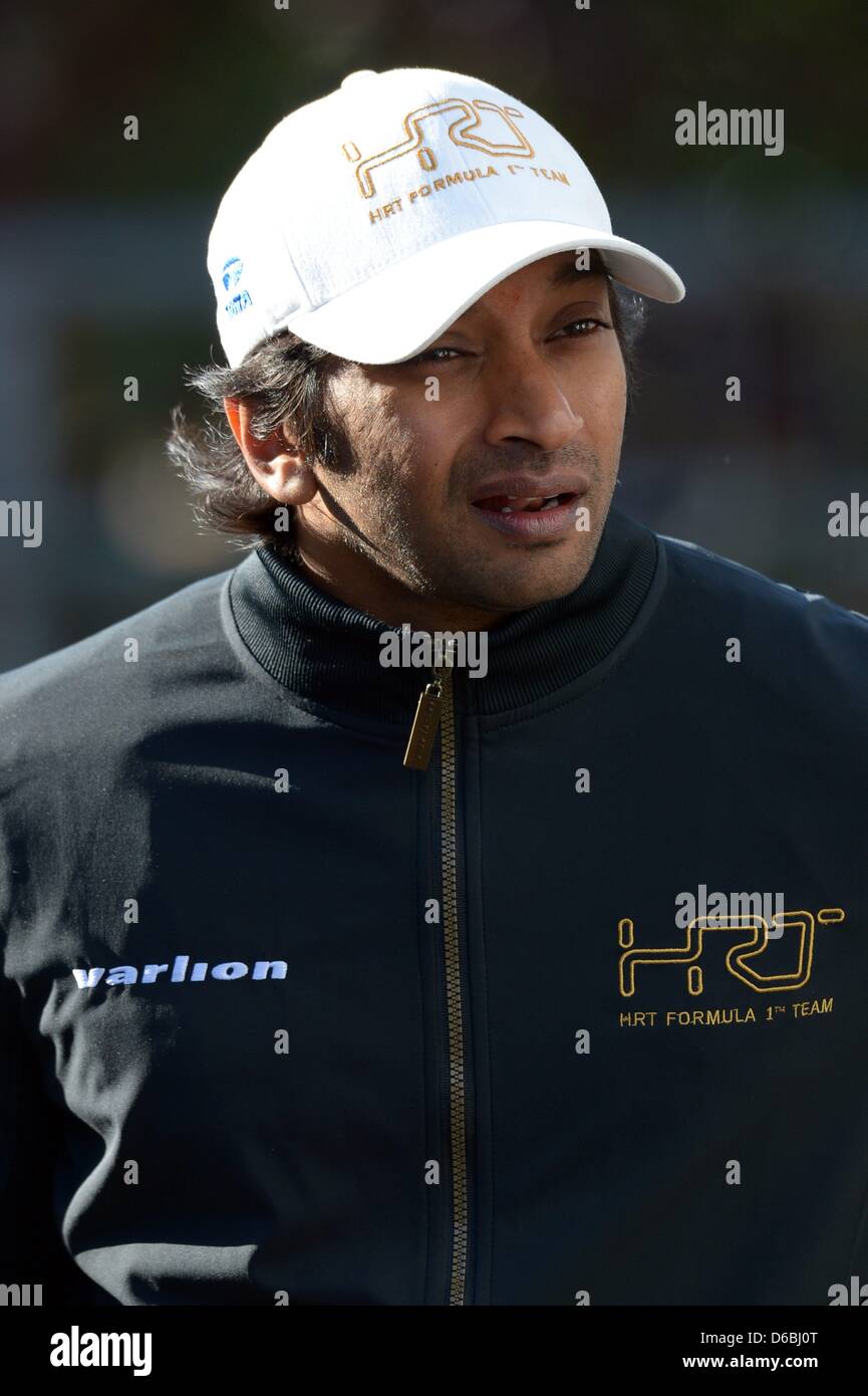 Indian Formula One driver Narain Karthikeyan of HRT arrives the paddock ...