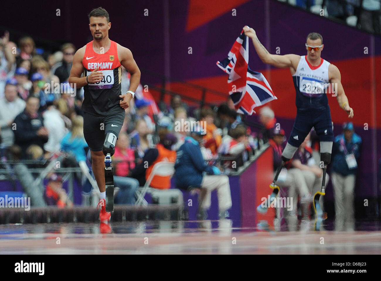 Bronze medalist Heinrich Popow (L) and gold medalist Richard Whitehead ...