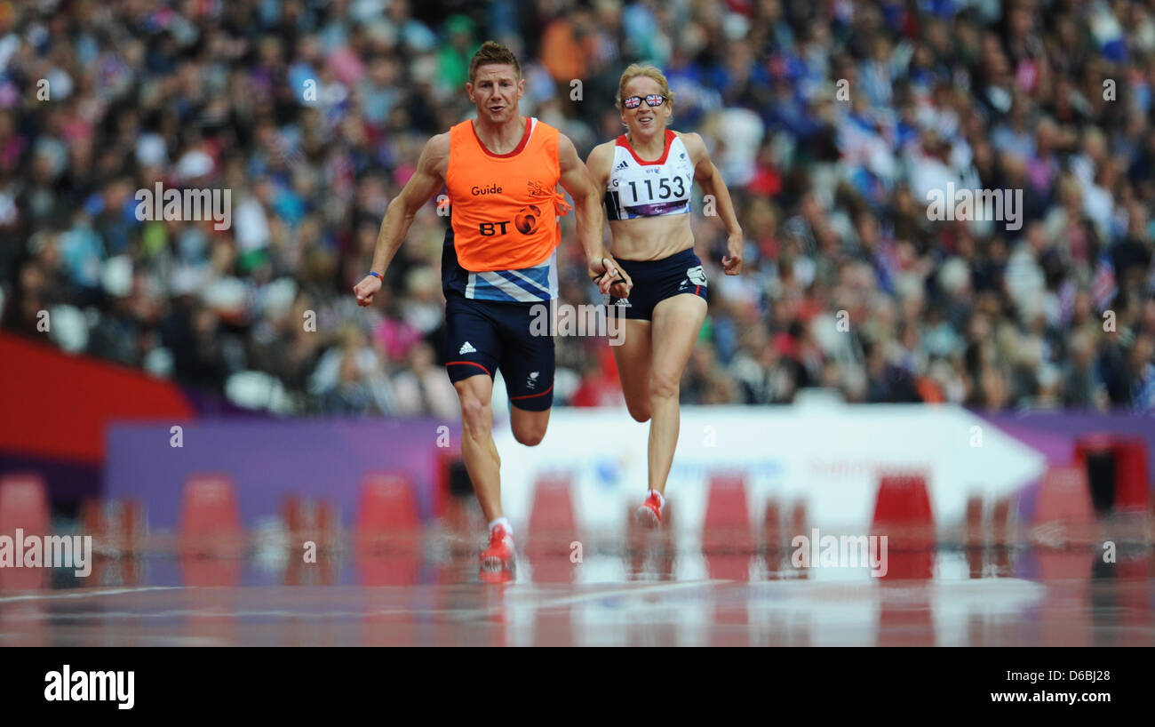 Tracey Hinton (r) of Great Britain and her guide Steffan Hughes compete ...