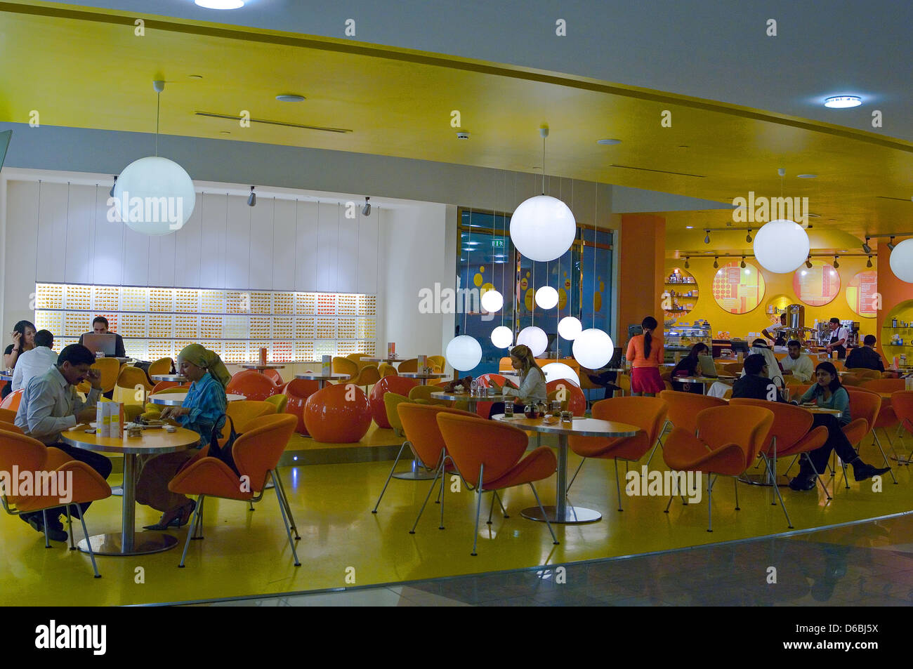 Dubai, people in a coffee bar of the Emirates Tower shopping center ...