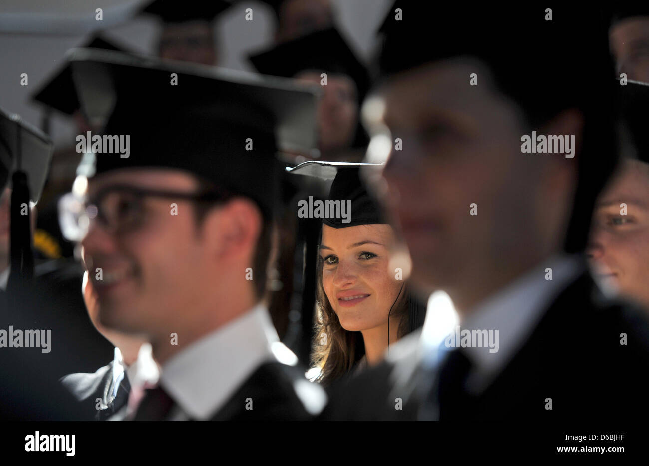University graduates attend graduation ceremony hi-res stock ...