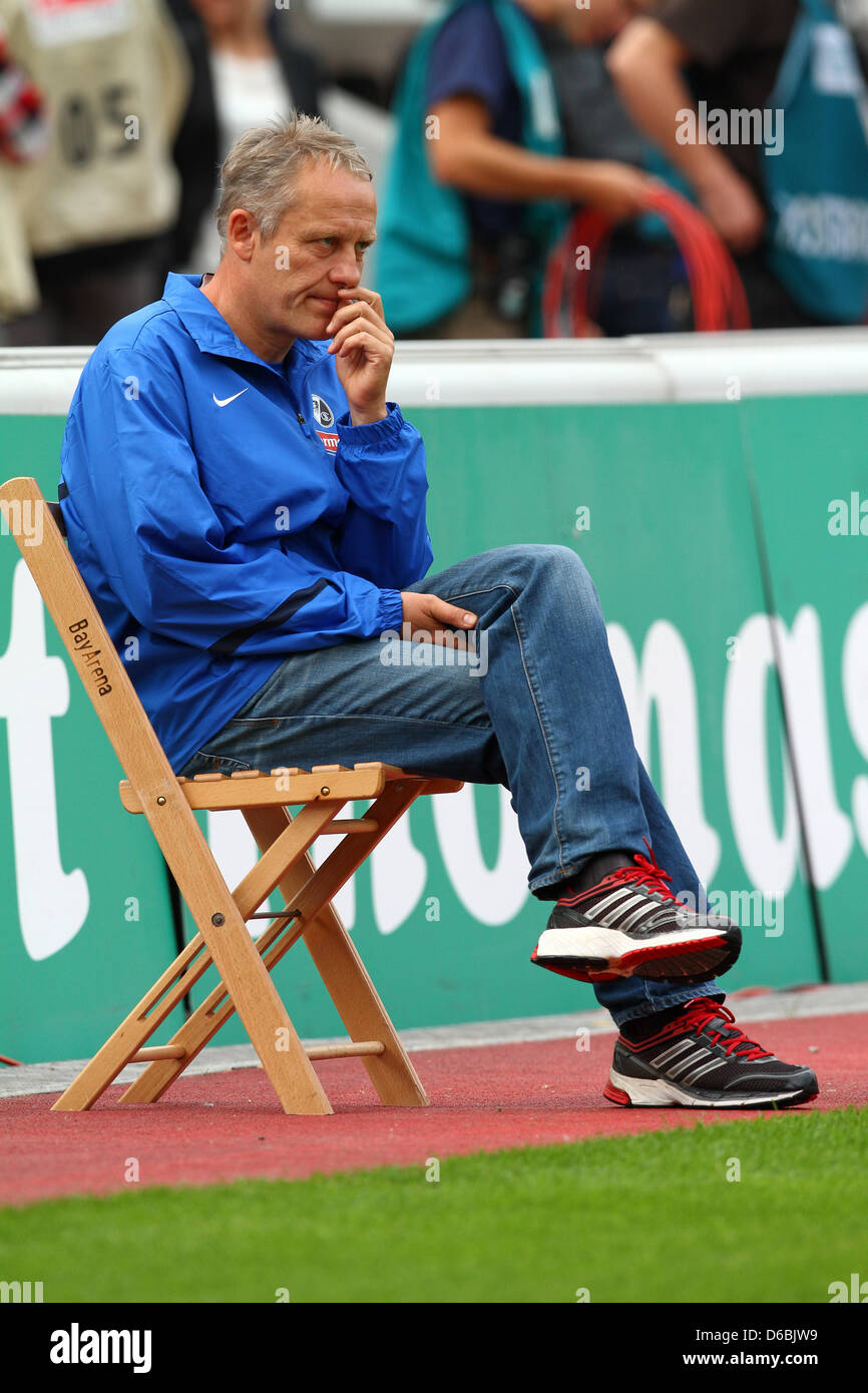 Freiburg's head coach Christian Streich sits on a chair before the ...