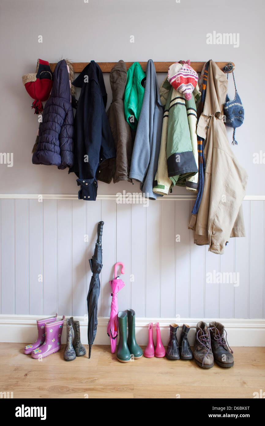 Coats hanging on a rack hi-res stock photography and images - Alamy