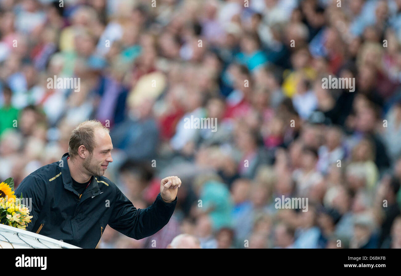 German discus thrower Robert Harting arrives in the stadium at the ...