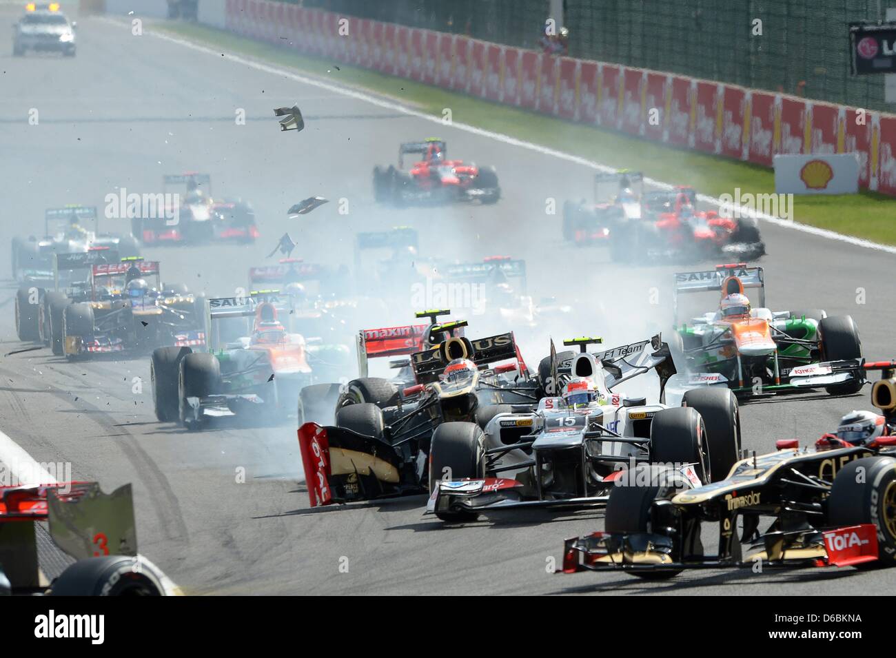 French Formula One driver Romain Grosjean of Lotus (l) and hits the ...