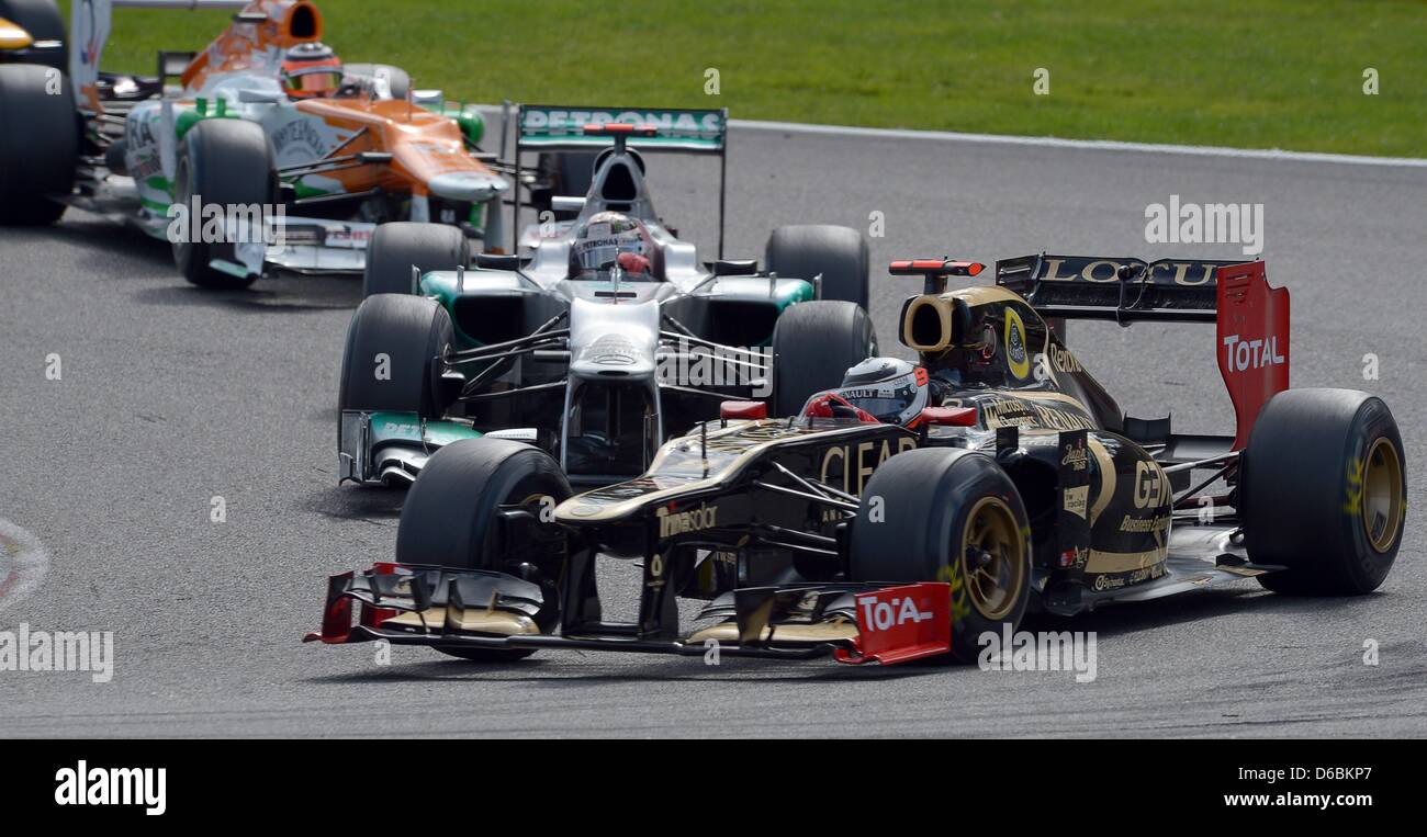 Finnish Formula One driver Kimi Raikkonen of Lotus leads ahead of ...