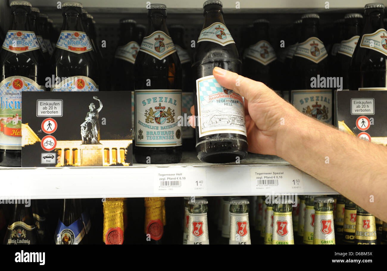 A postcard, which reads 'purchasing after 8pm prohibited', stands ...