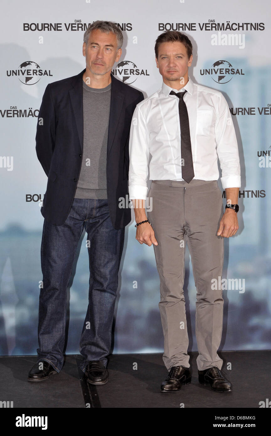 US actor Jeremy Renner (R) and director Tony Gilroy pose for ...