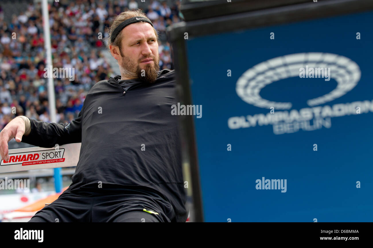 Polish shot putter Tomasz Majewskisits on a bench the men's shot put ...