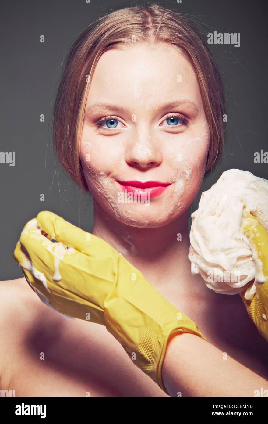 Woman having face scrubbed Stock Photo - Alamy