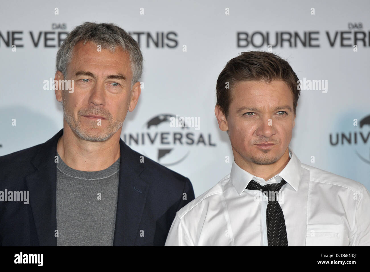 American actor Jeremy Renner (R) and director Tony Gilroy attend a ...