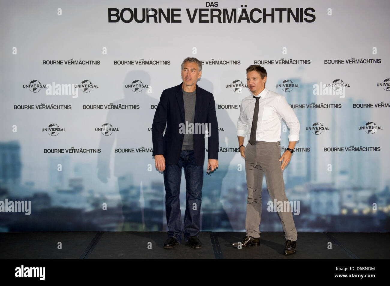 American actor Jeremy Renner (R) and director Tony Gilroy attend a ...