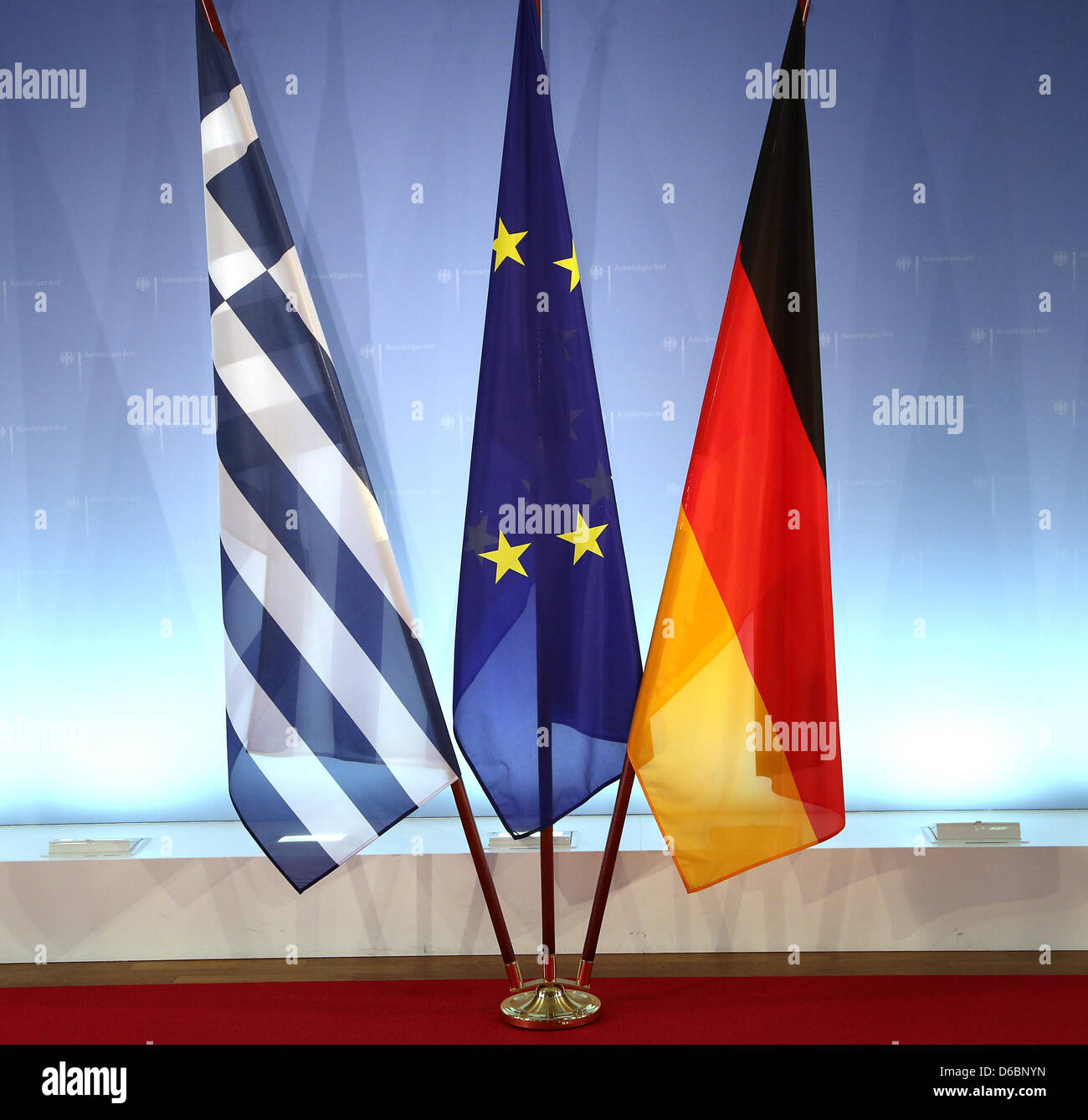 The German, Greek and EU flags stand next to each other as German ...