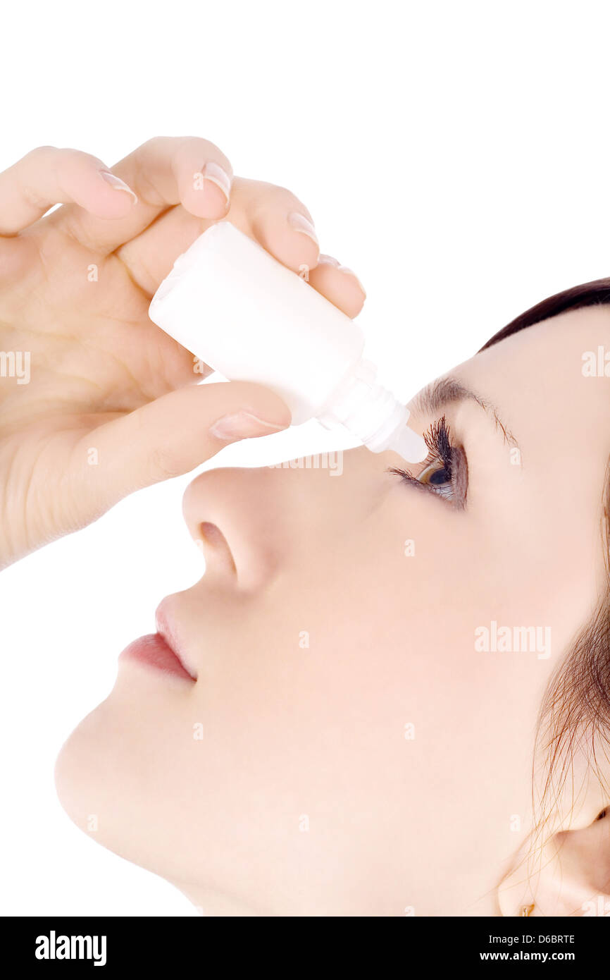 woman dripping eye with eyes drops Stock Photo - Alamy