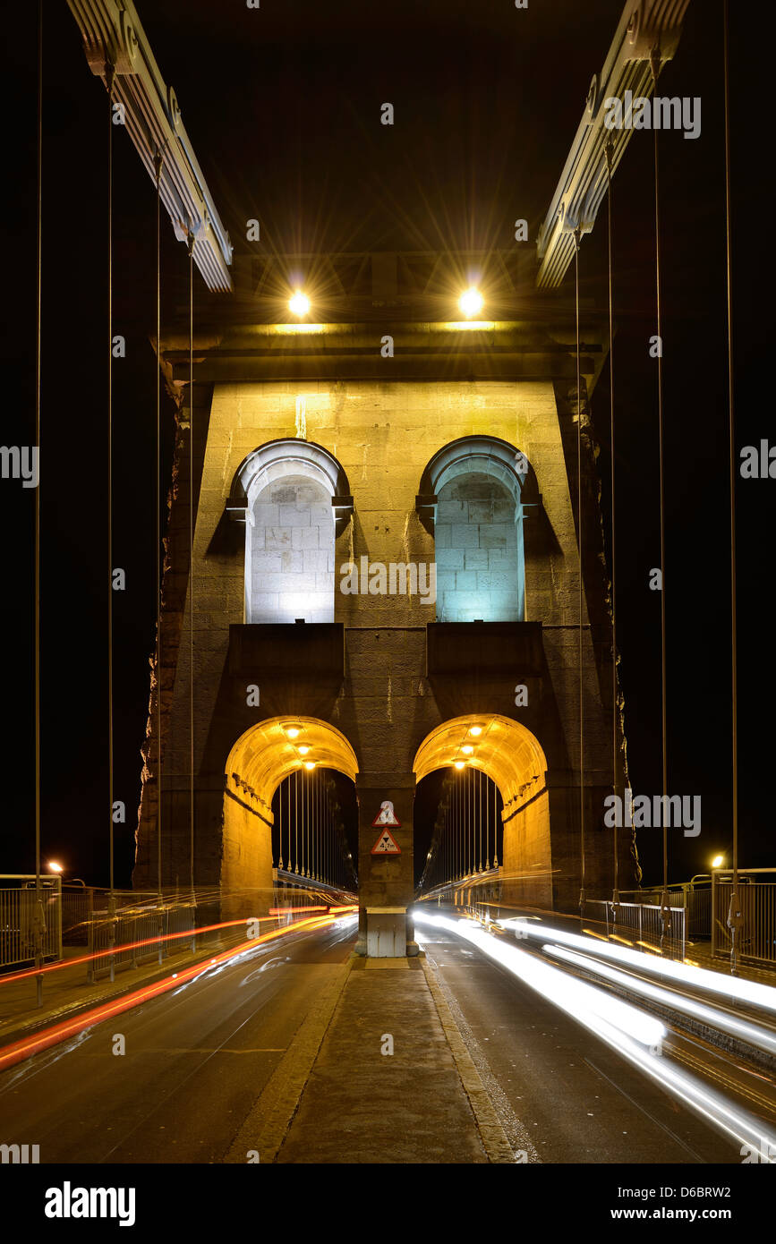 One of the Menai Bridge's archways illuminated at night. Anglesey, UK ...