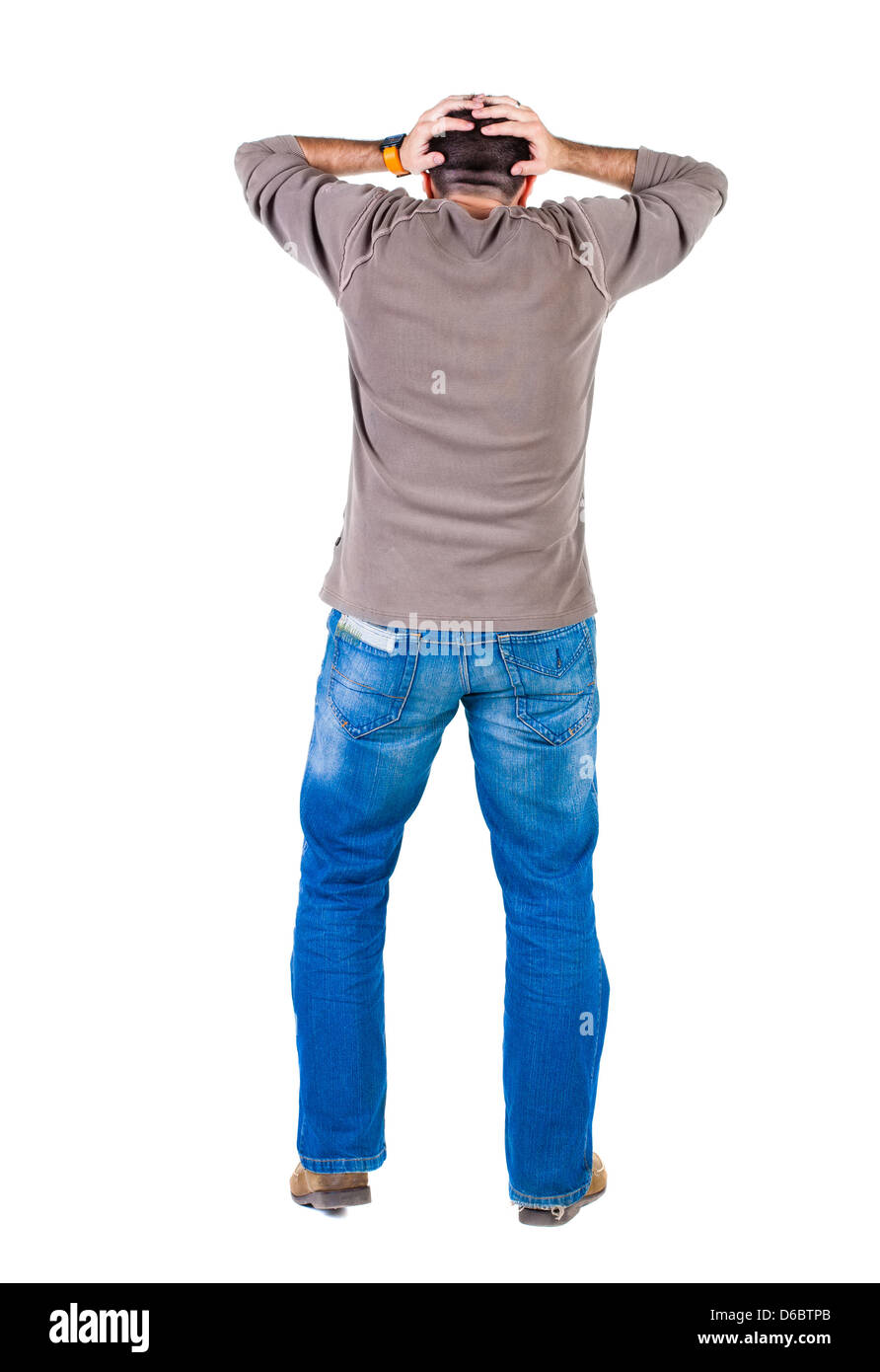 Back view of shocked and scared young man. Hold hands upwards. Rear ...