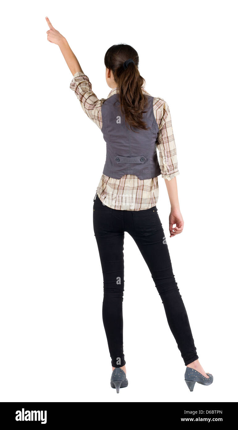 Back view of pointing young brunette woman. Beautiful girl in shirt ...
