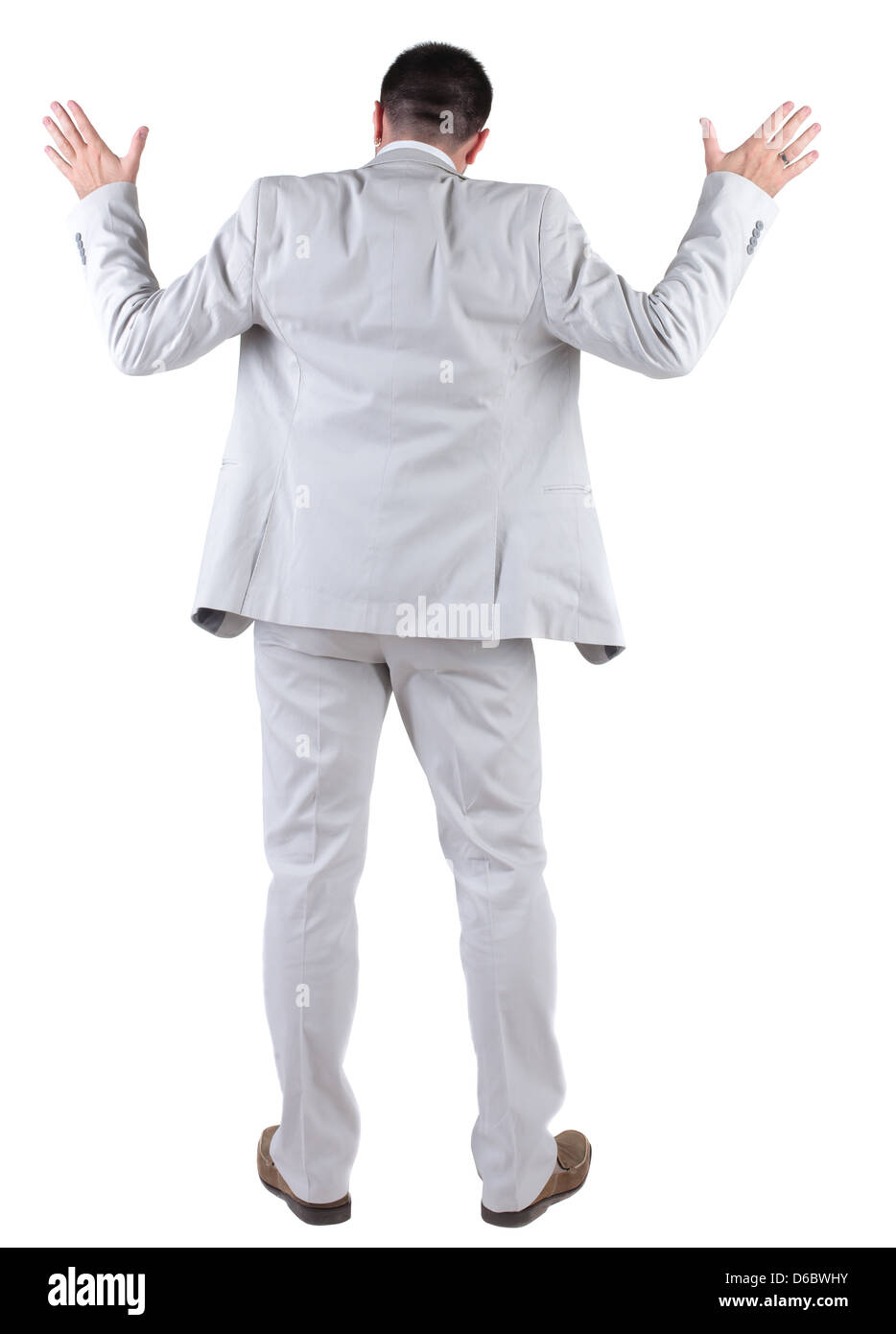 Back view of thinking young business man in white suit. Rear view ...