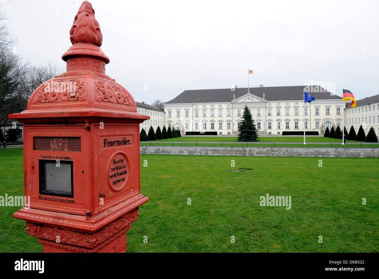 A historic fire-alarm stands in front of the Bellevue Palace, home to ...