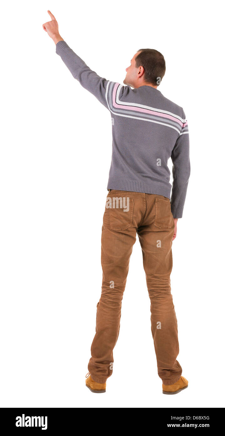 Back view of pointing young men in sweater and jeans. Young guy ...