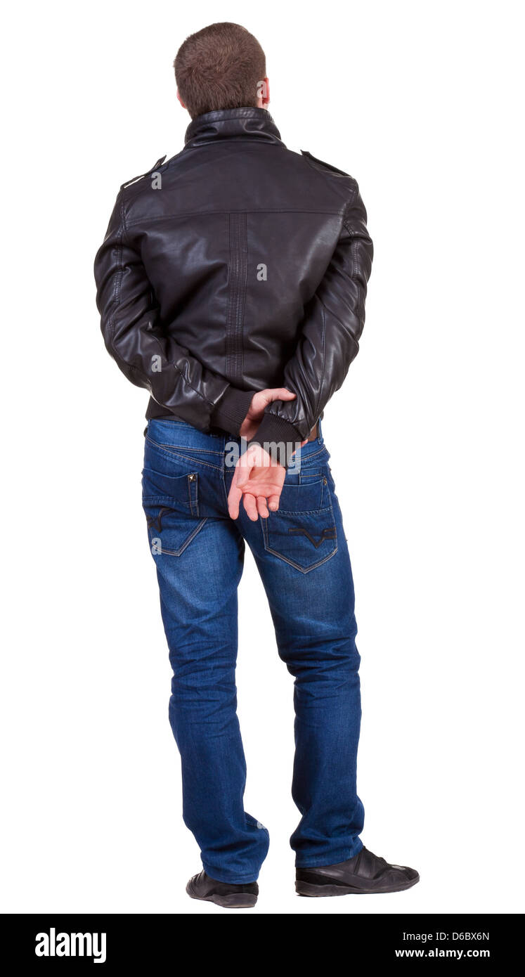 Back view of handsome man in jacket looking up. Standing young guy in ...