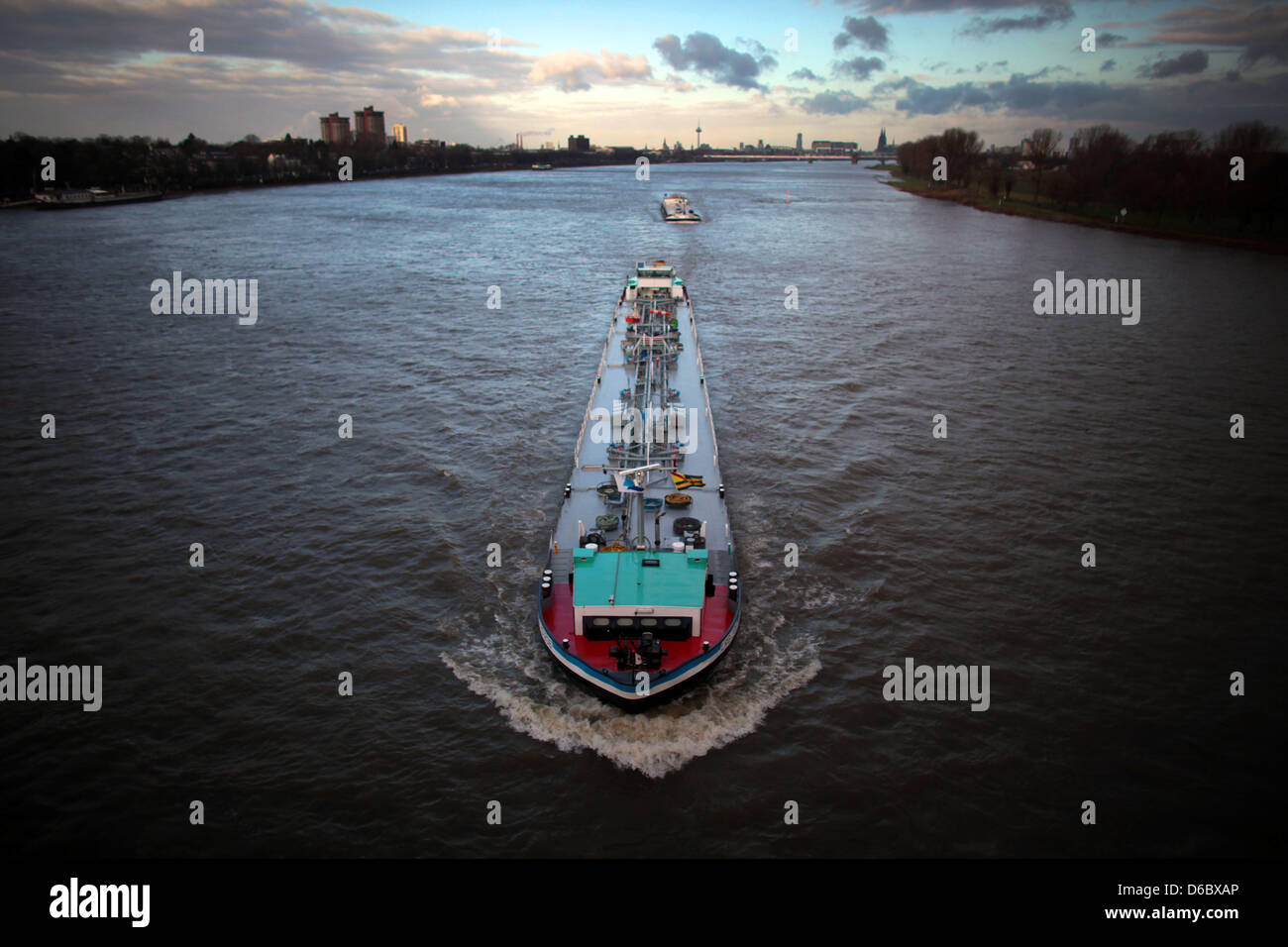 An inland waterway craft travels down the Rhine in Cologne, Germany, 04 ...