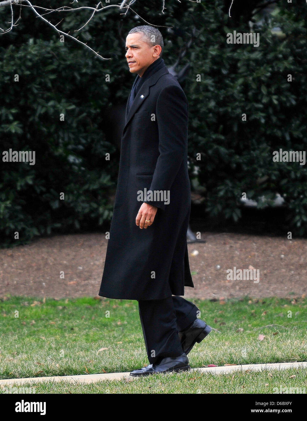 United States President Barack Obama waves to the cameras as he walks ...