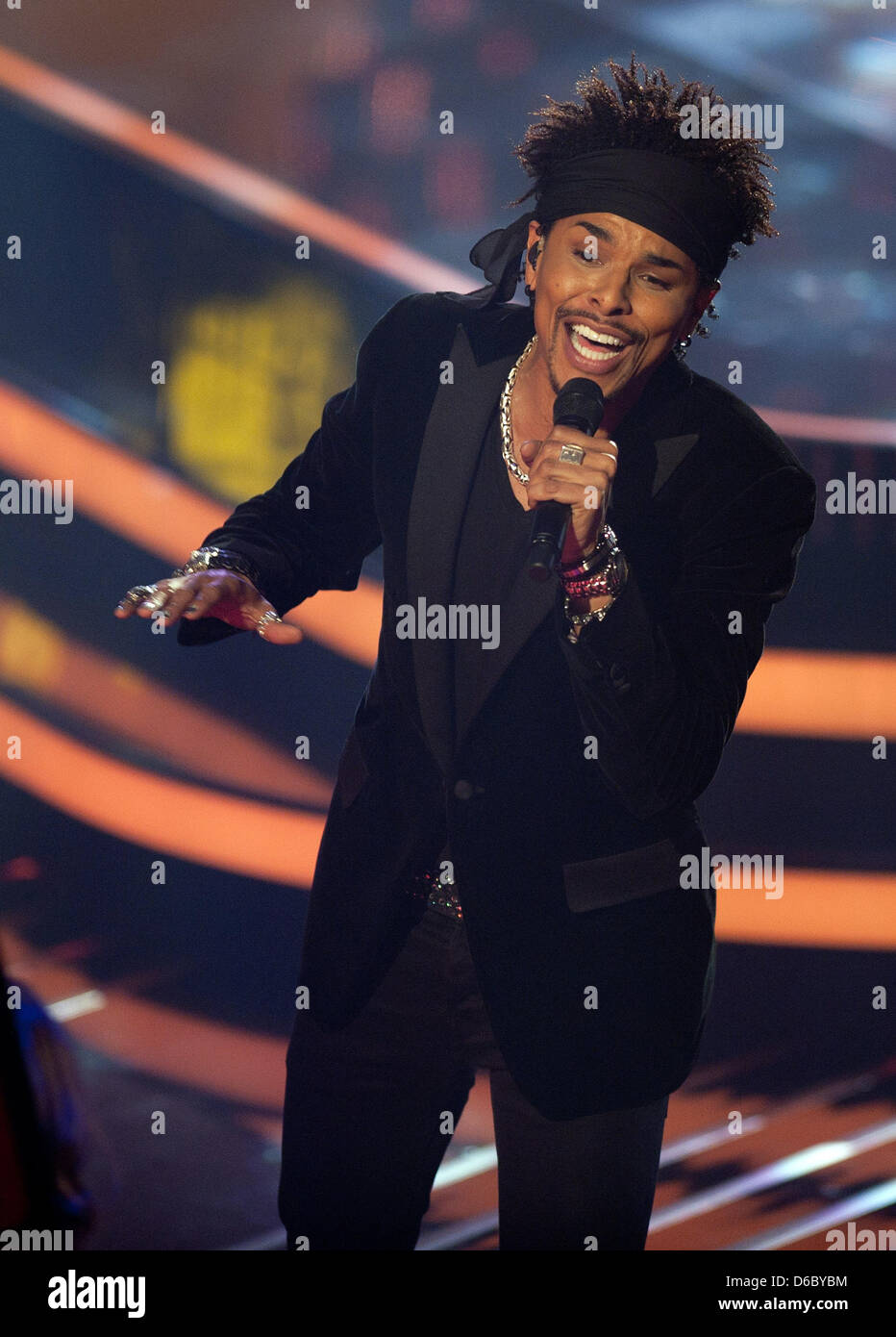 Candidate Collin 'C.' Jay sings on stage during the first live show of ...