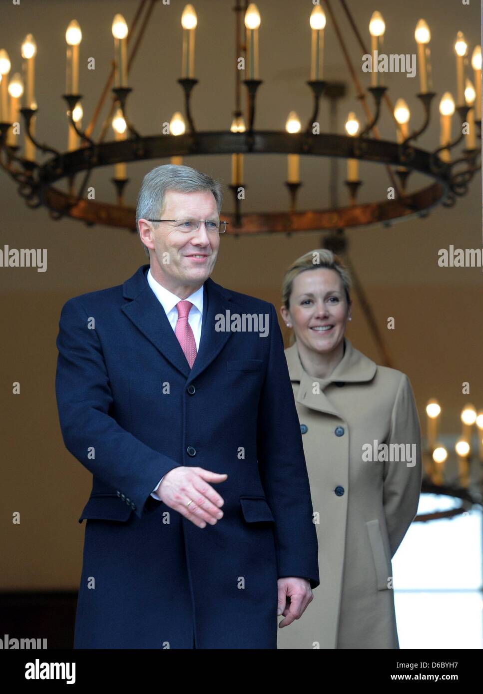 German President Christian Wulff and his wife Bettina walk out of the ...