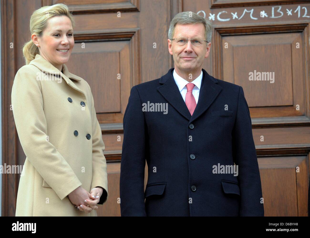 German President Christian Wulff and his wife Bettina walk out of the ...