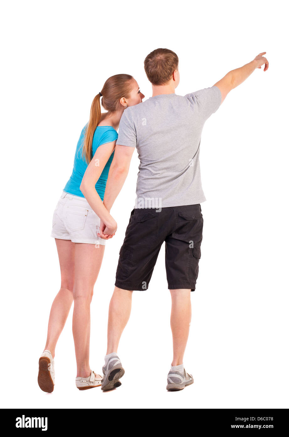 Back view of young couple pointing at wall (woman and man). Rear view ... Back view of young couple pointing at wall (woman and man). Rear view ...