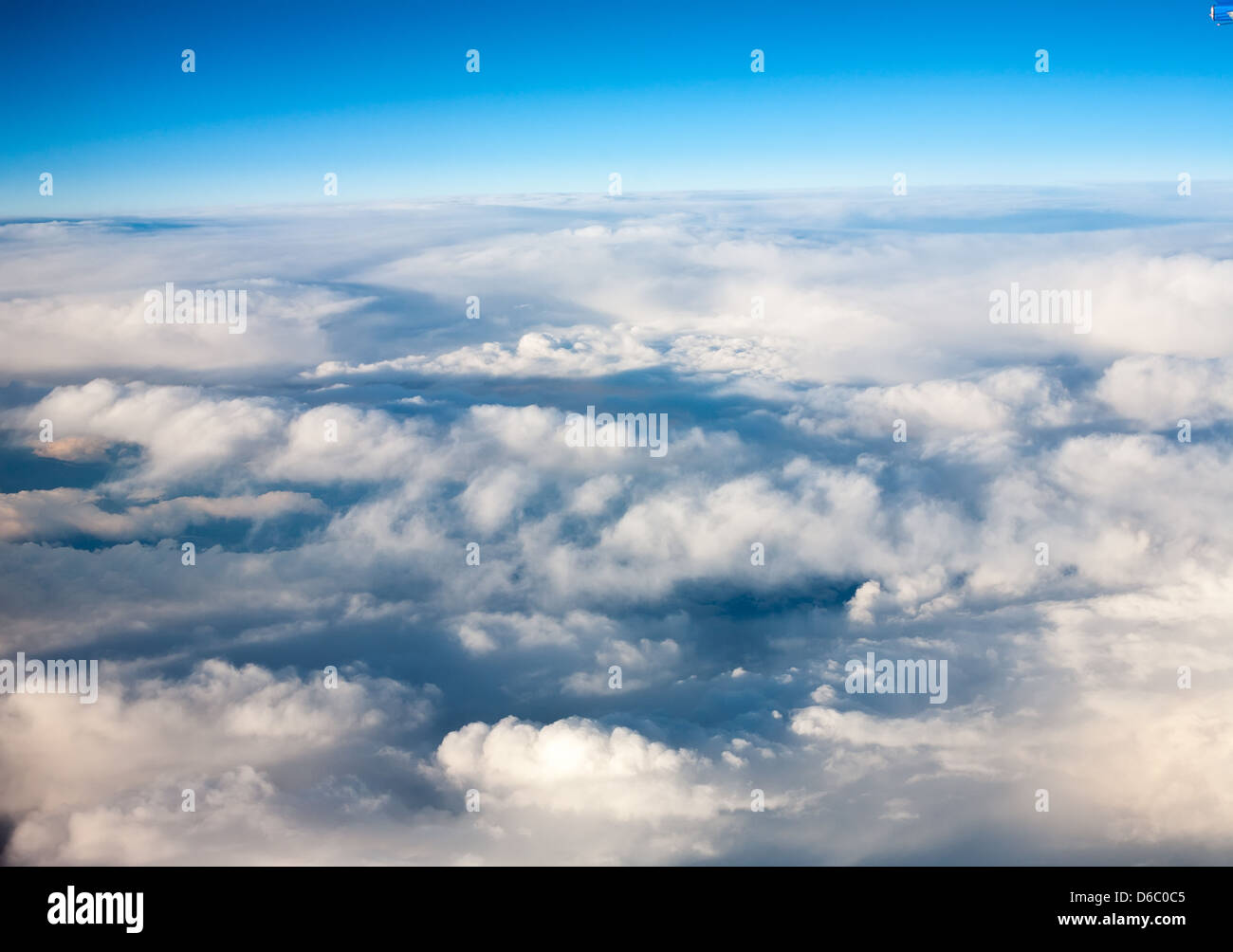 clouds. top view from window of airplane flying in clouds. top view ...