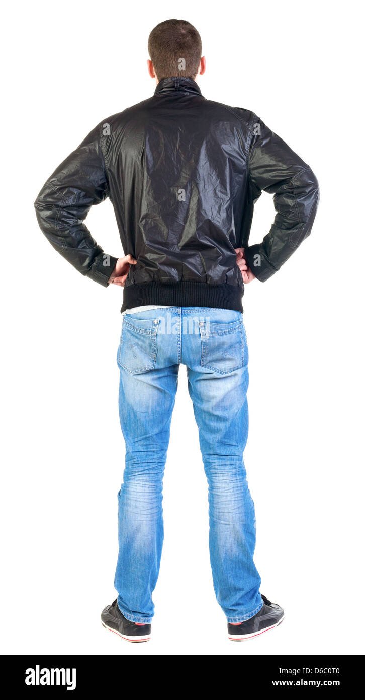 Back view of handsome man in jacket looking up. Standing young guy in ...