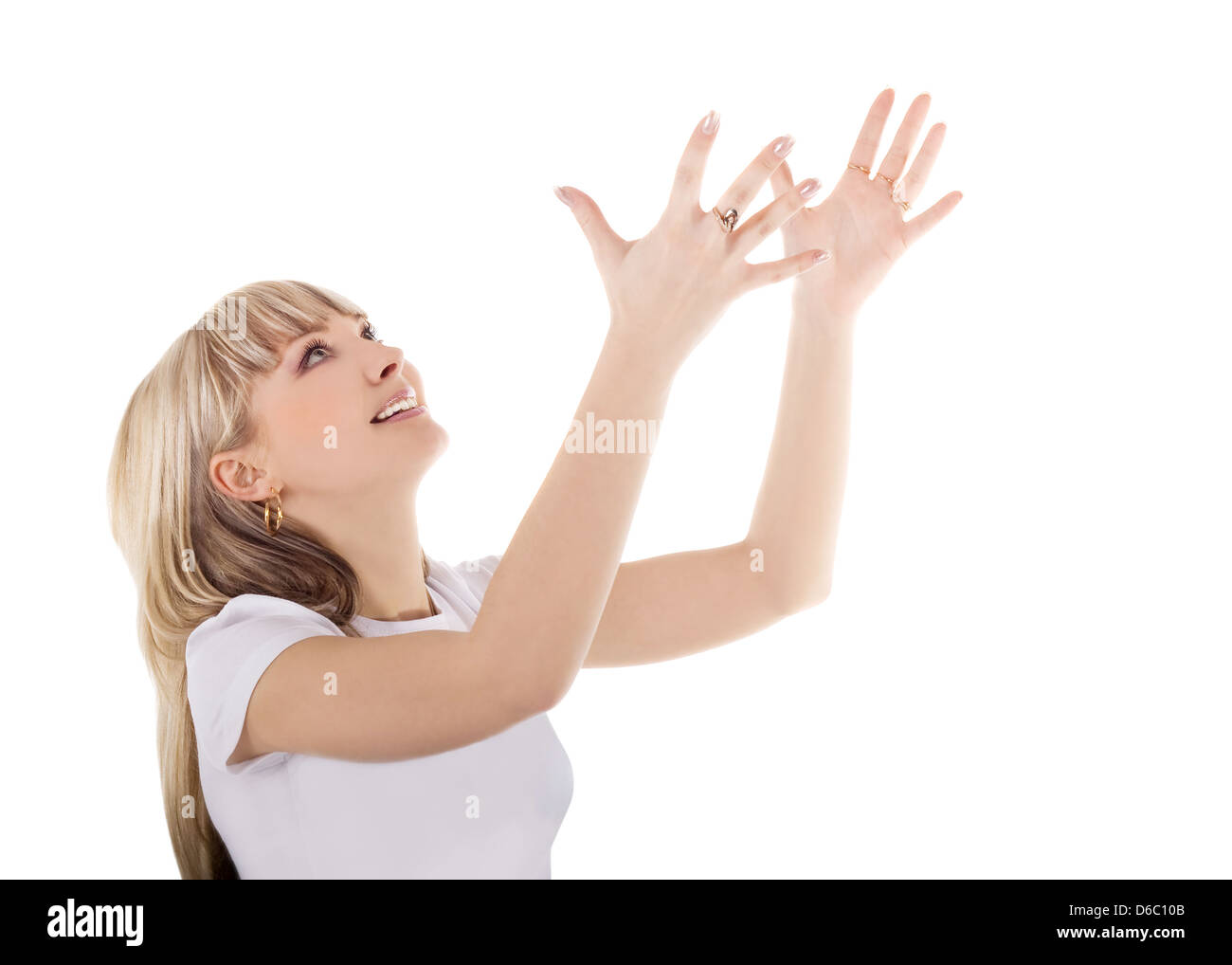 lovely blond throw something from her hands Stock Photo - Alamy