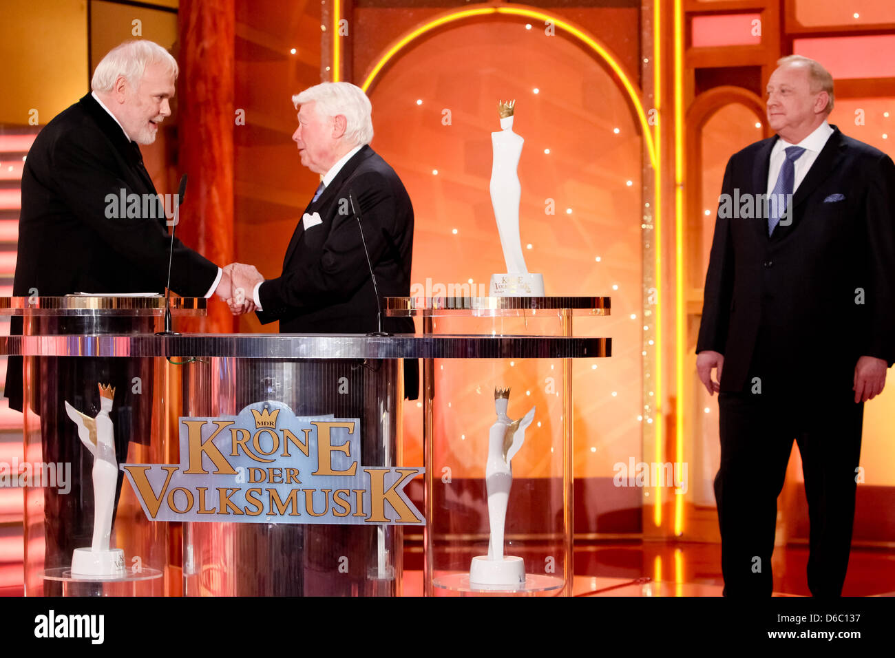 TV host Gunther Emmerlich (L-R) congratulates Austrian director ...
