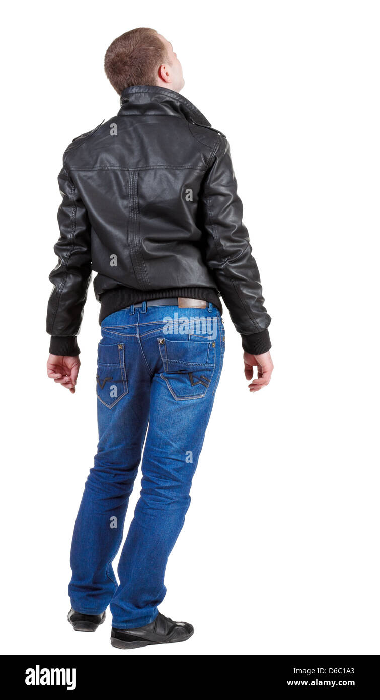 Back view of handsome man in jacket looking up. Standing young guy in ...