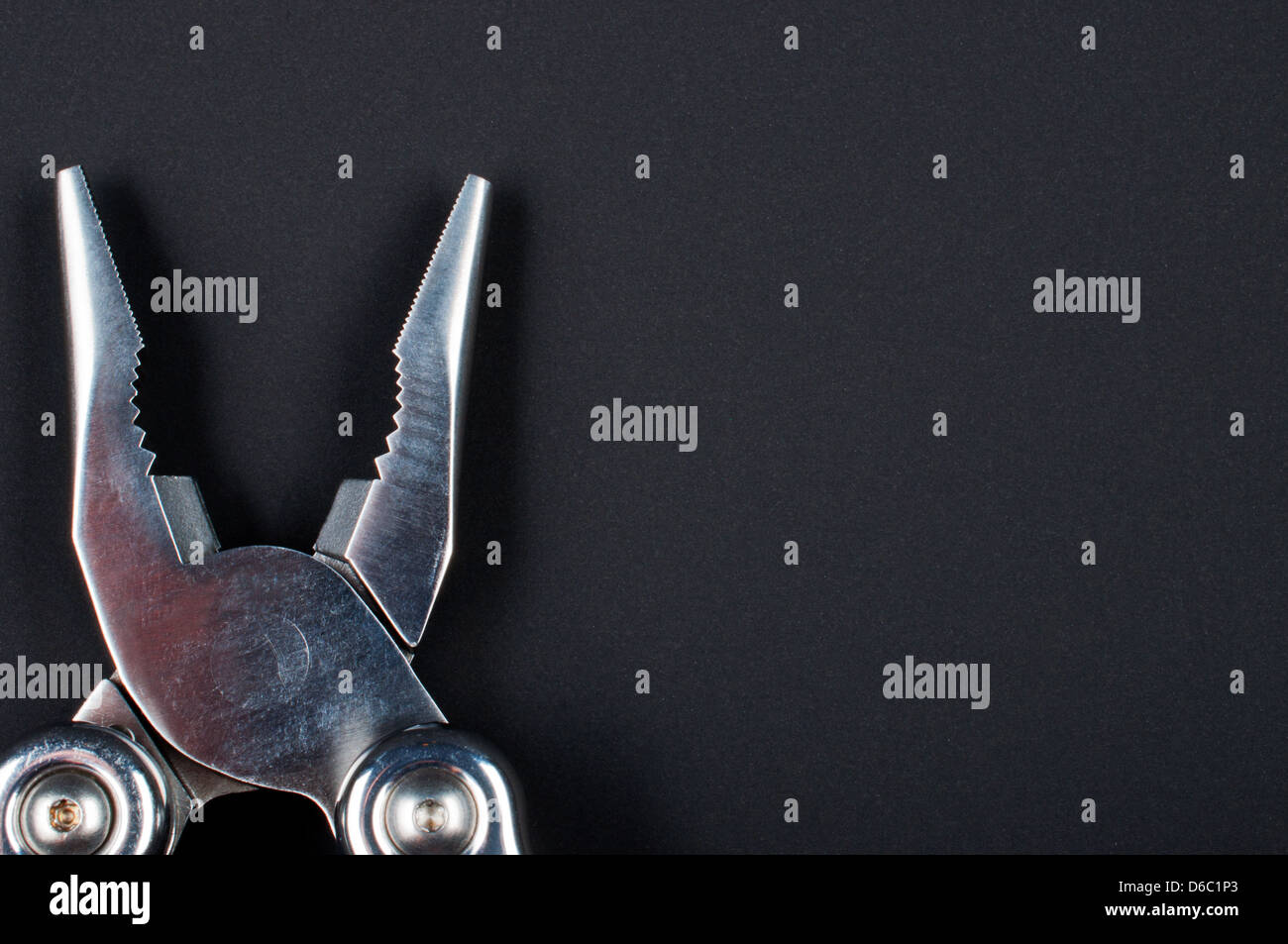 Close up pliers black background Stock Photo - Alamy