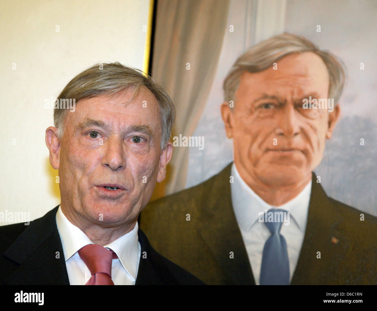 Former German President Horst Koehler poses for a picture next to his ...