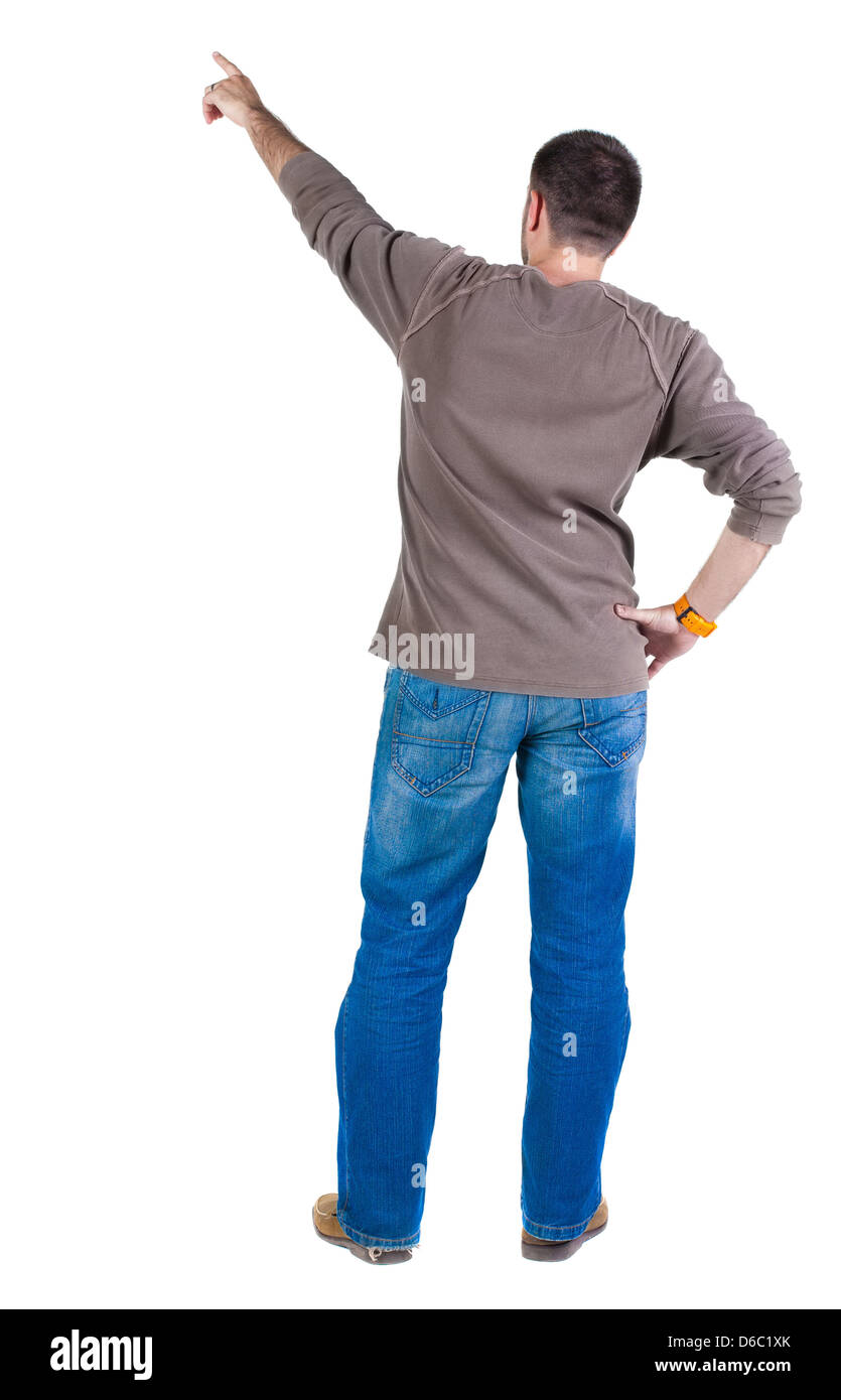 Back view of young man pointing at wall. Rear view people collection ...