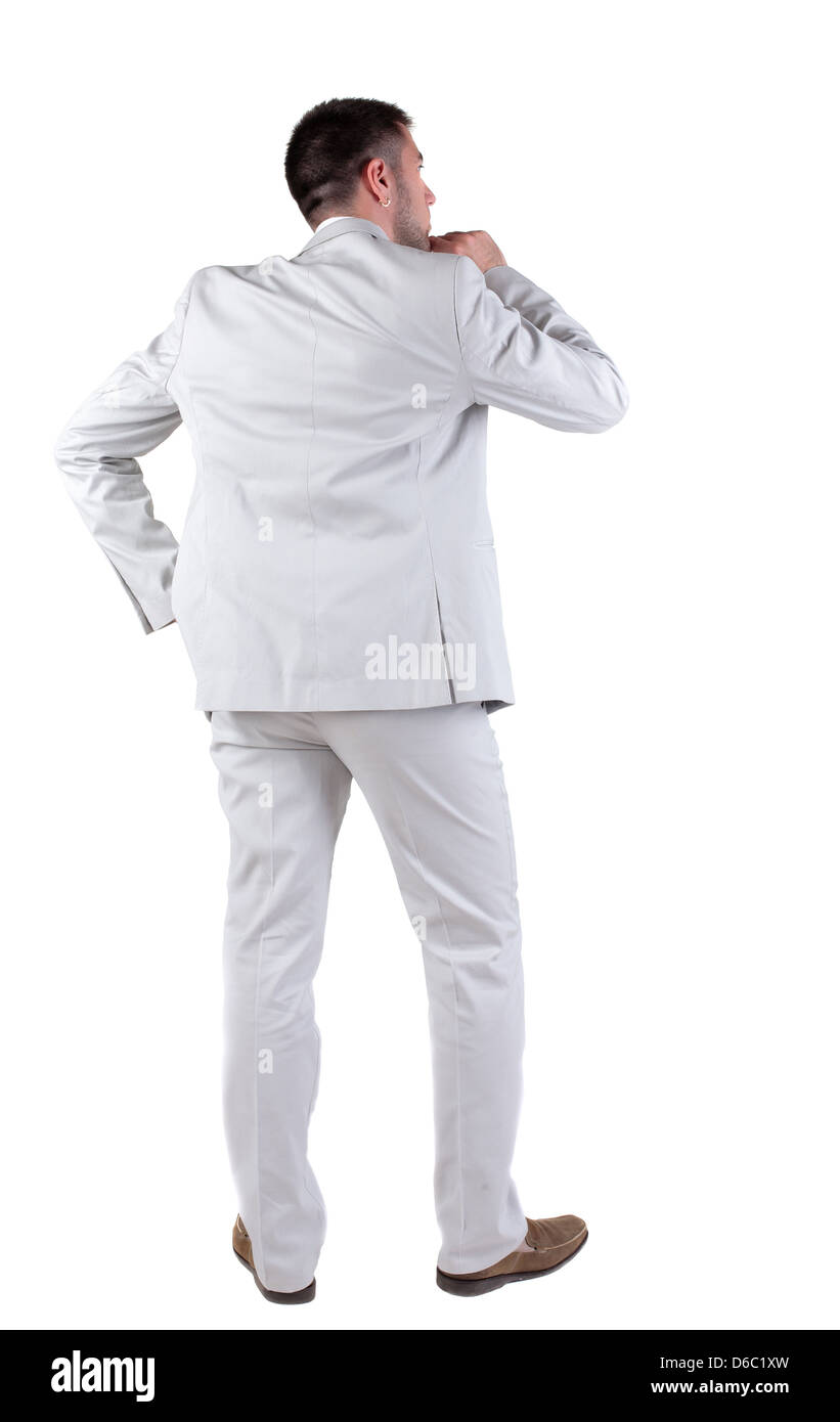 Back view of thinking young business man in white suit. Rear view ...