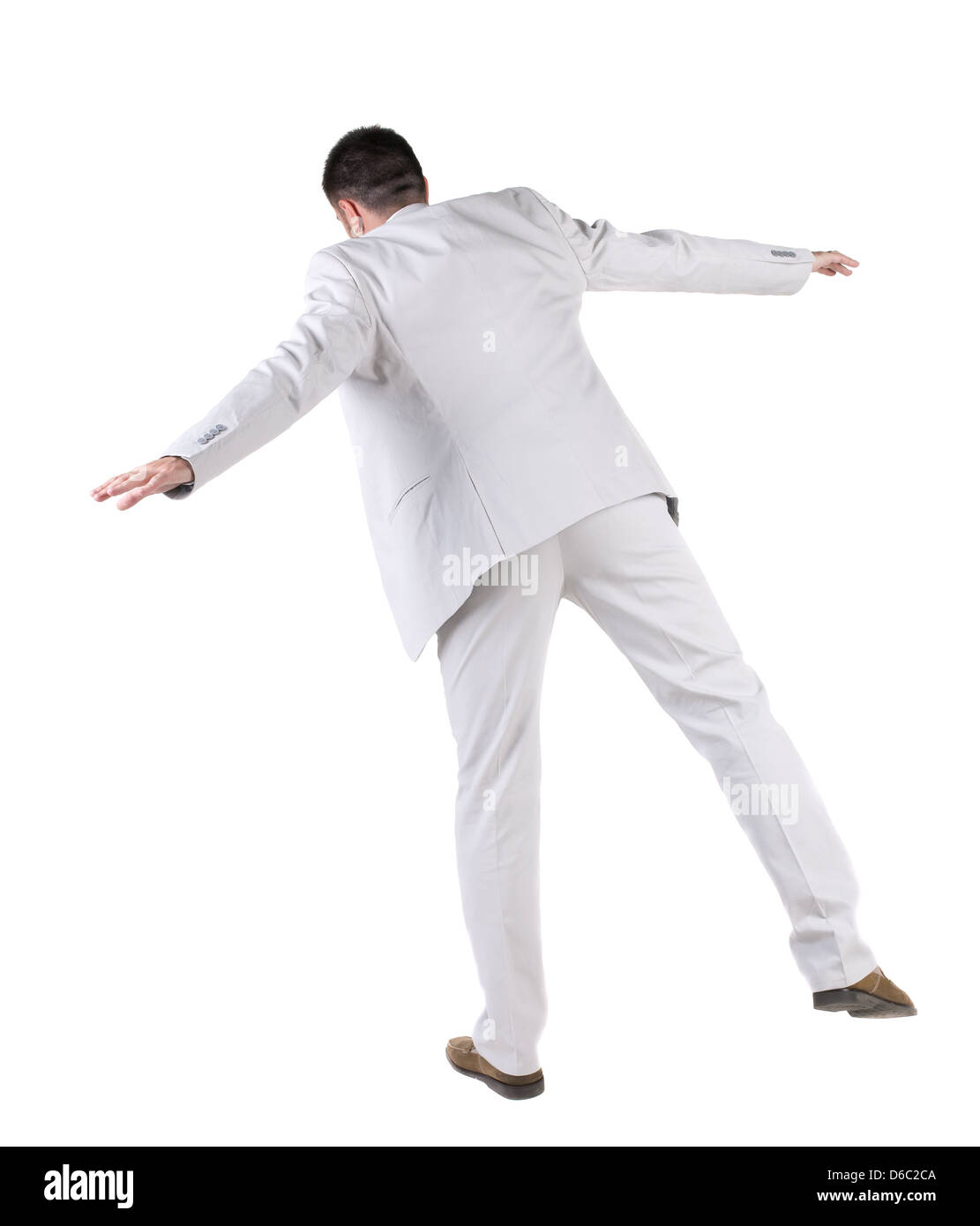 Balancing businessman . Rear view. Isolated over white background Stock ...